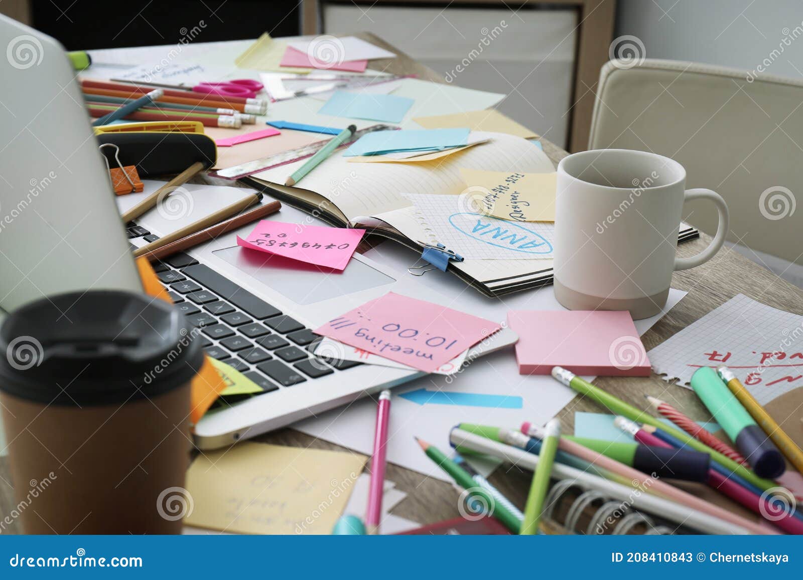Laptop, Notes and Office Stationery in Mess on Desk. Overwhelmed with ...