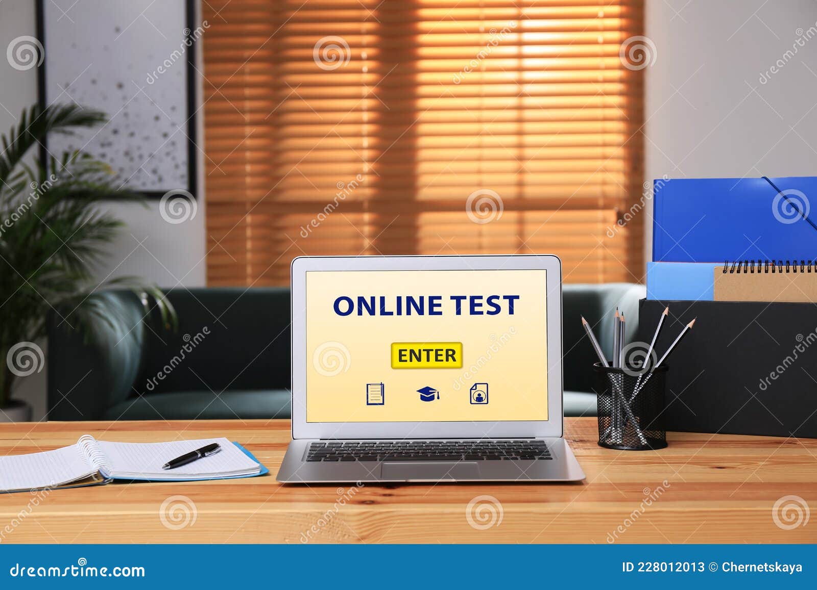 Laptop with Online Test and Stationery on Table in Office Stock Image ...