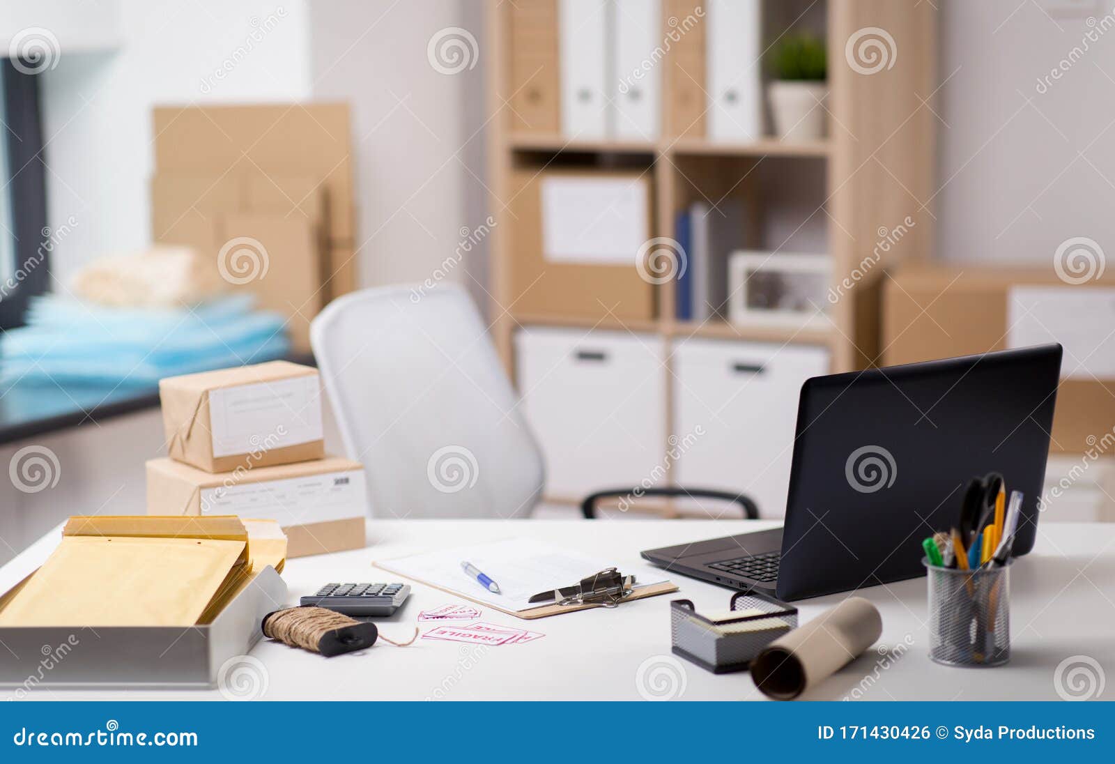 Laptop and Parcels on Table at Post Office Stock Photo - Image of ...