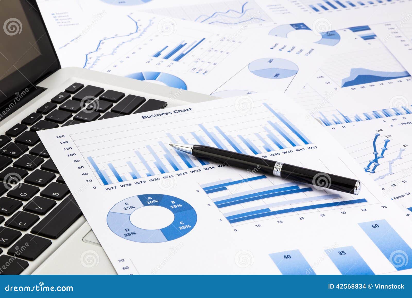 Laptop and Pen with Blue Business Charts, Graphs, Statistic and Stock ...