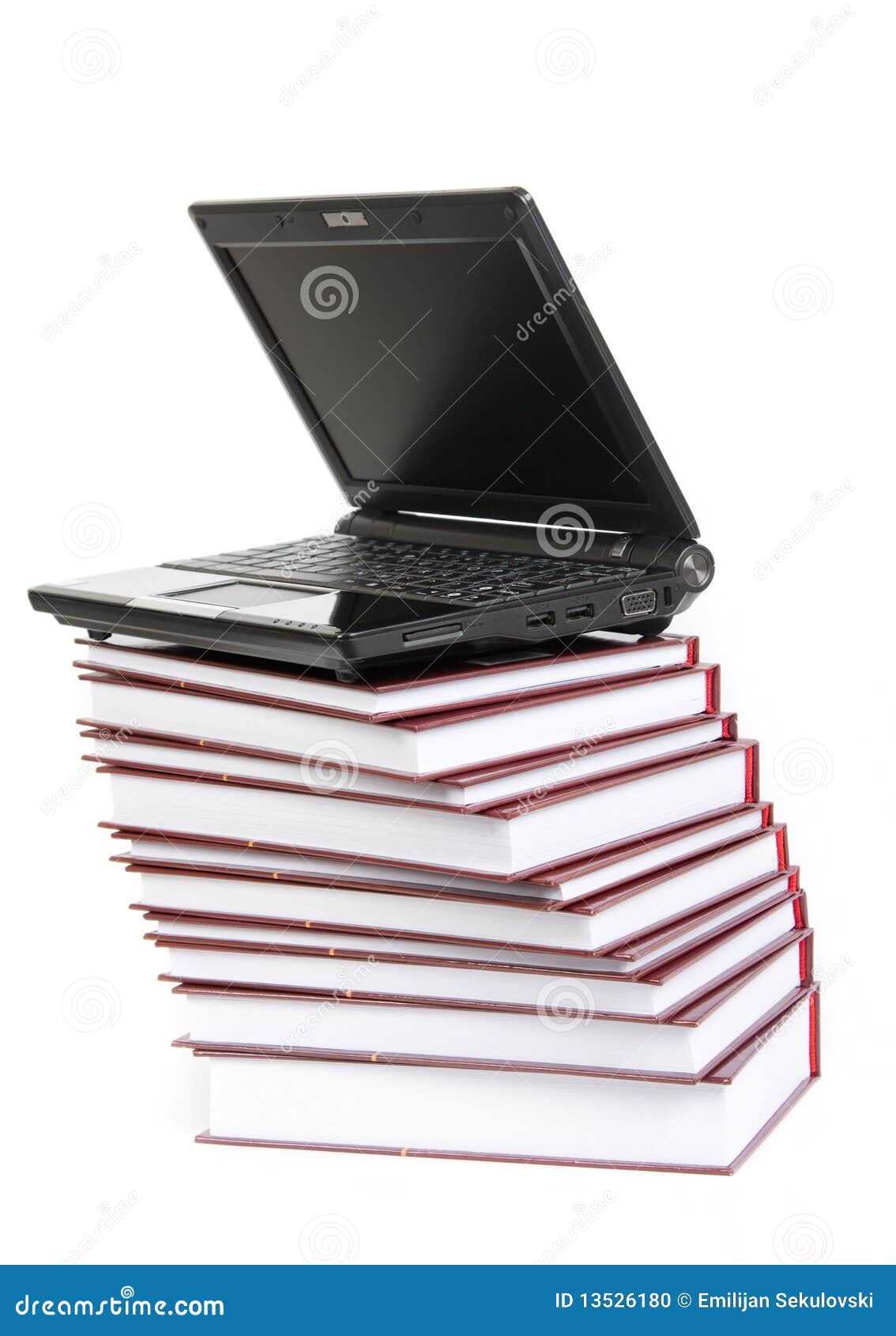 Laptop on a pile of books stock photo. Image of information - 13526180