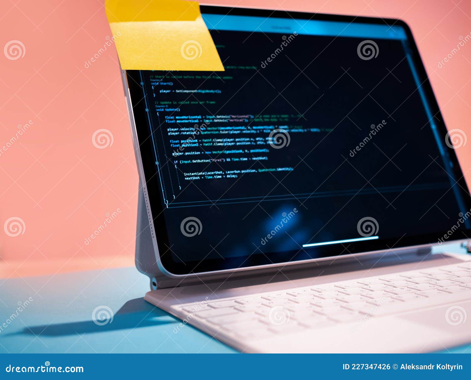 A Laptop with a Reminder and the Program Code on the Monitor. Time ...