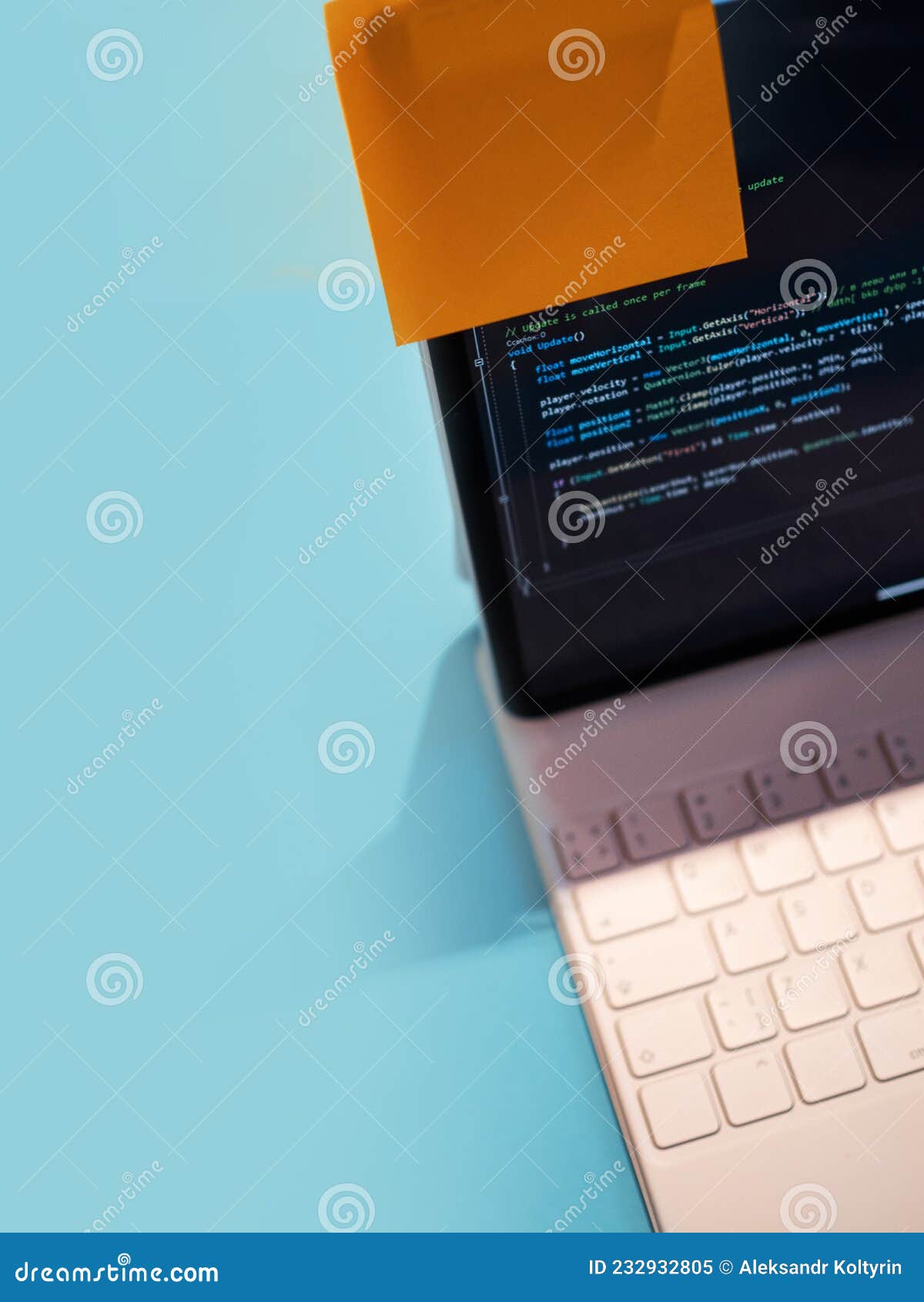 A Laptop with a Reminder and the Program Code on the Monitor. Time ...