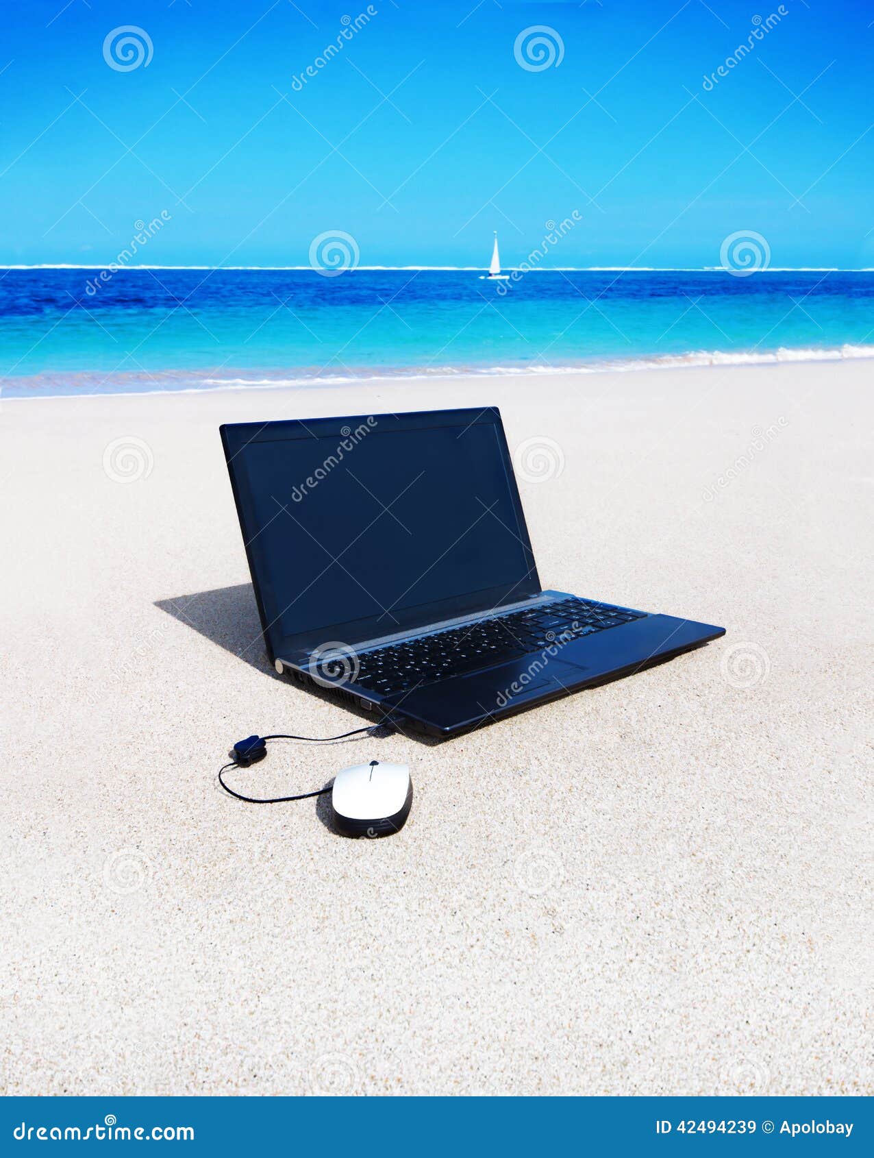 Laptop on the sand beach stock image. Image of electronic - 42494239