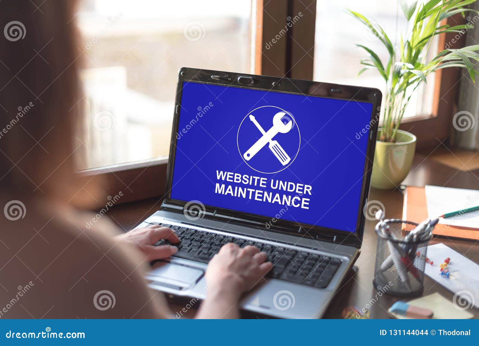 Website Maintenance Concept on a Laptop Screen Stock Photo - Image of ...