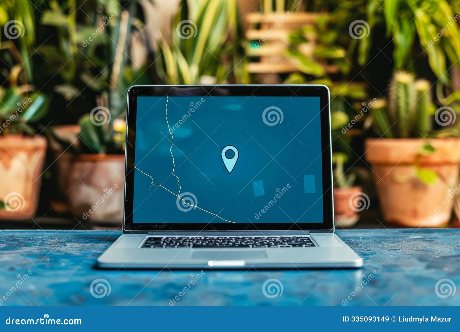 A Laptop Screen Shows a Blue Dot on a Map of the World. Stock Image ...