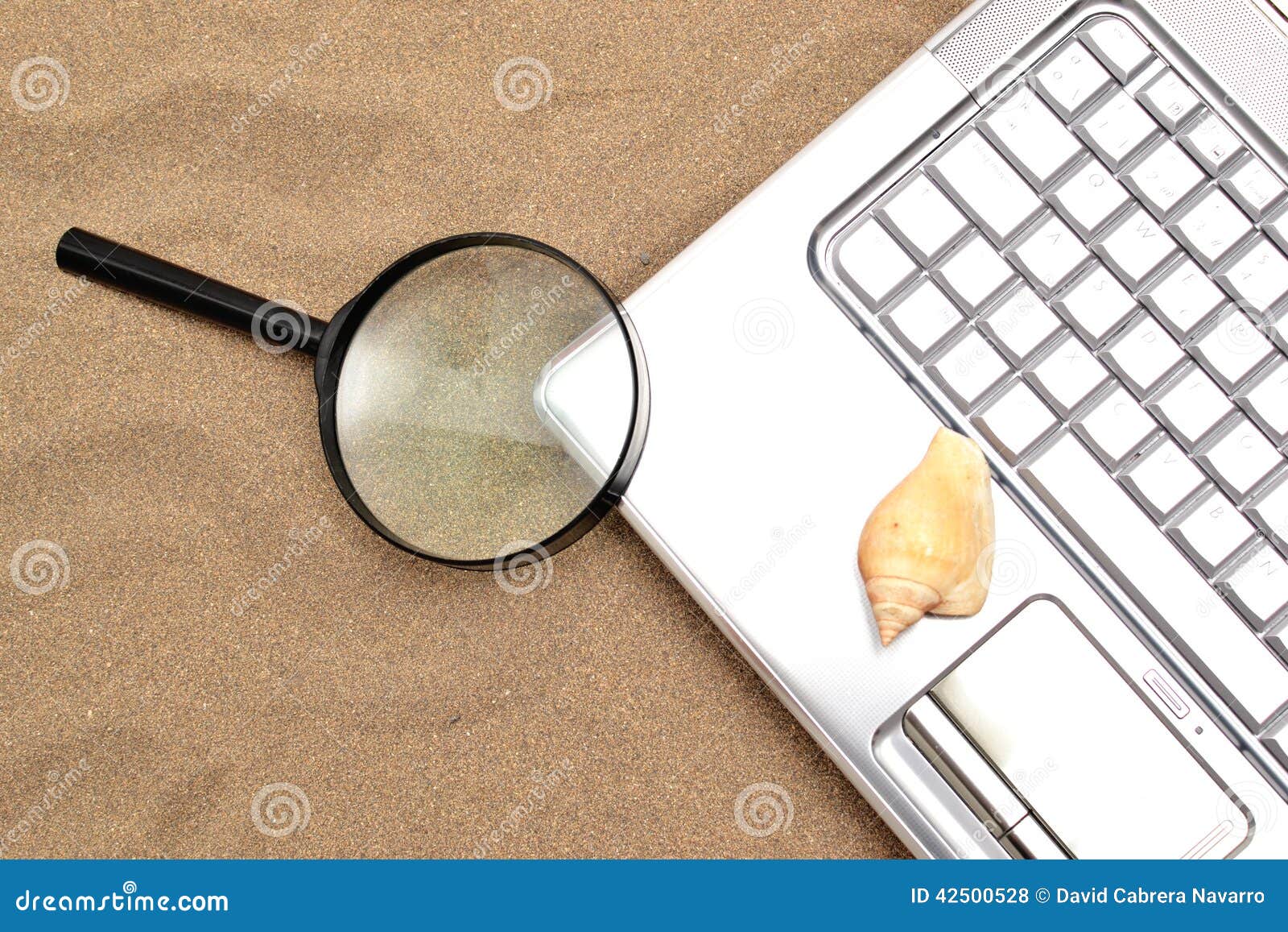 Laptop and shell on sand stock photo. Image of communications - 42500528