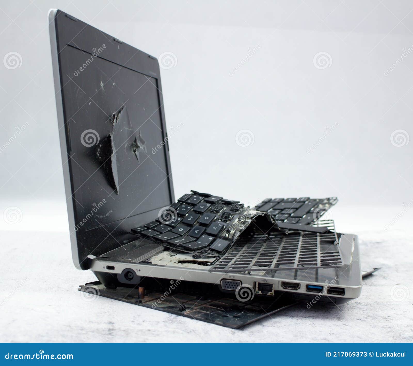 The Laptop is Smashed To Pieces. the Screen is Cracked, the Keyboard is ...