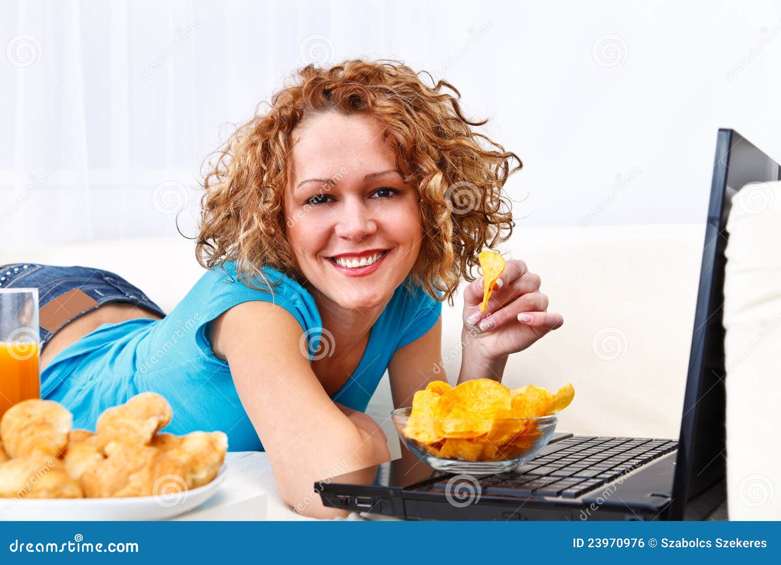 Laptop and snacks stock photo. Image of woman, pretty - 23970976