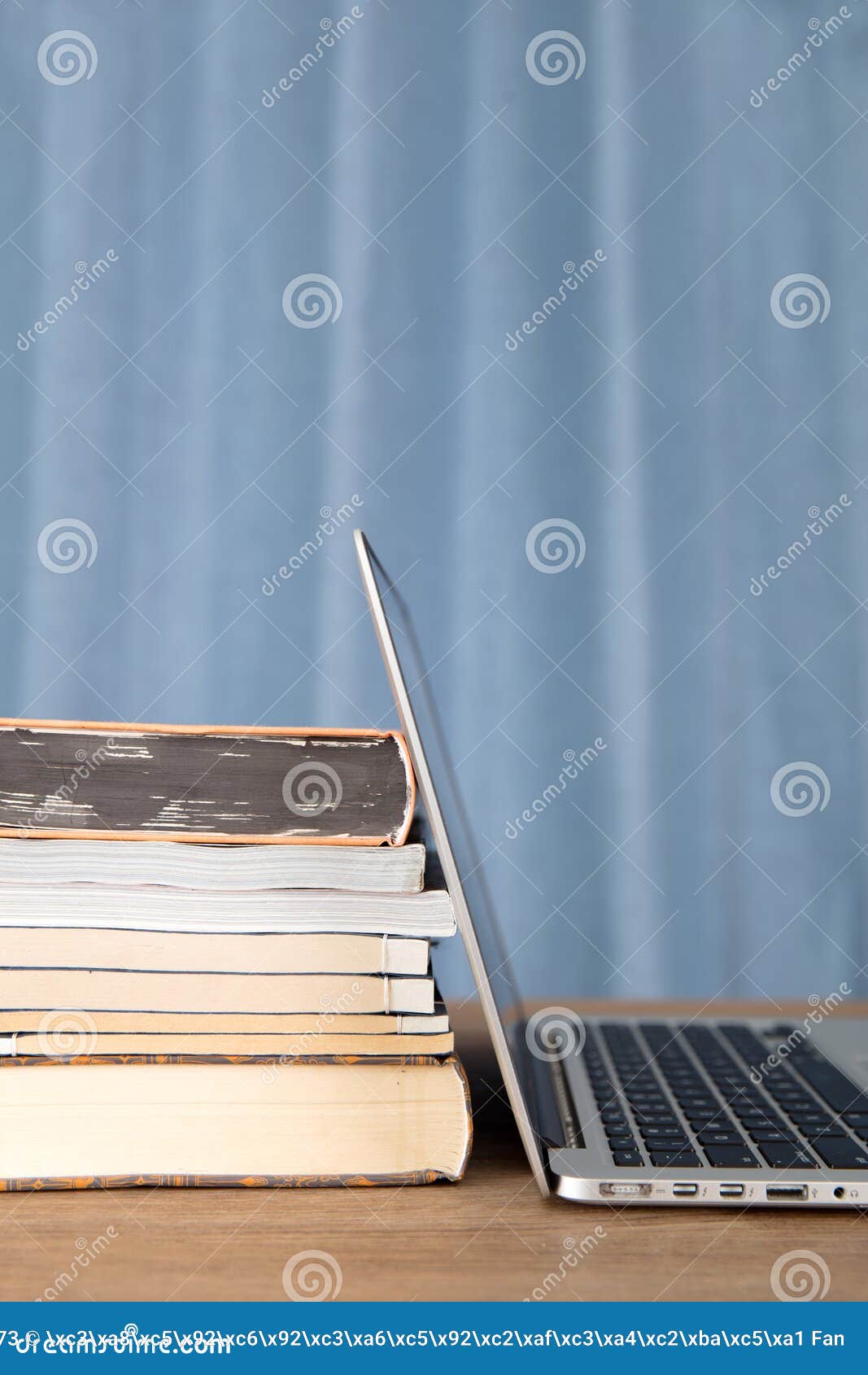 Laptop and stack of books stock image. Image of young - 253779673