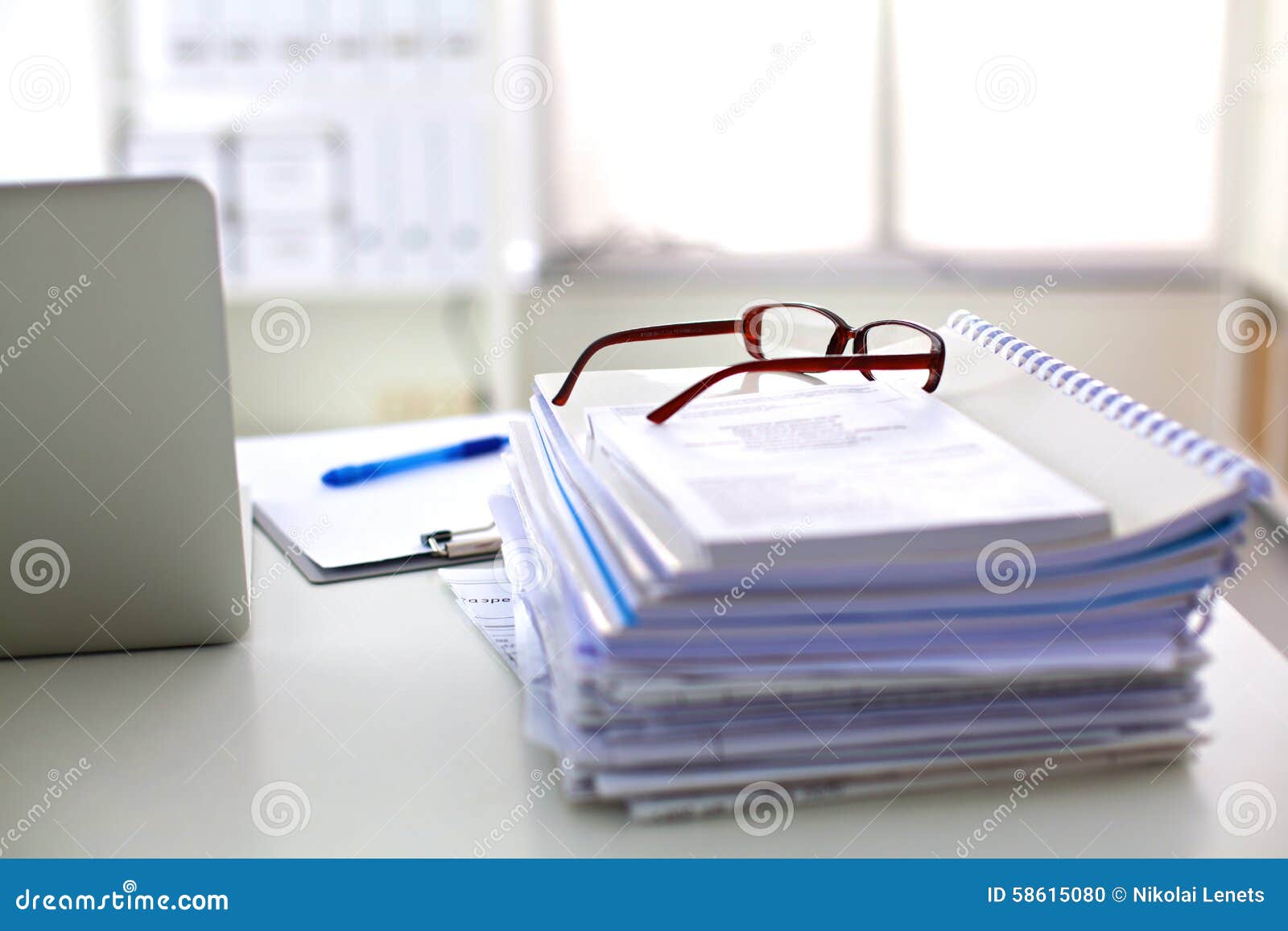 Laptop with Stack of Folders on Table on White Stock Photo - Image of ...