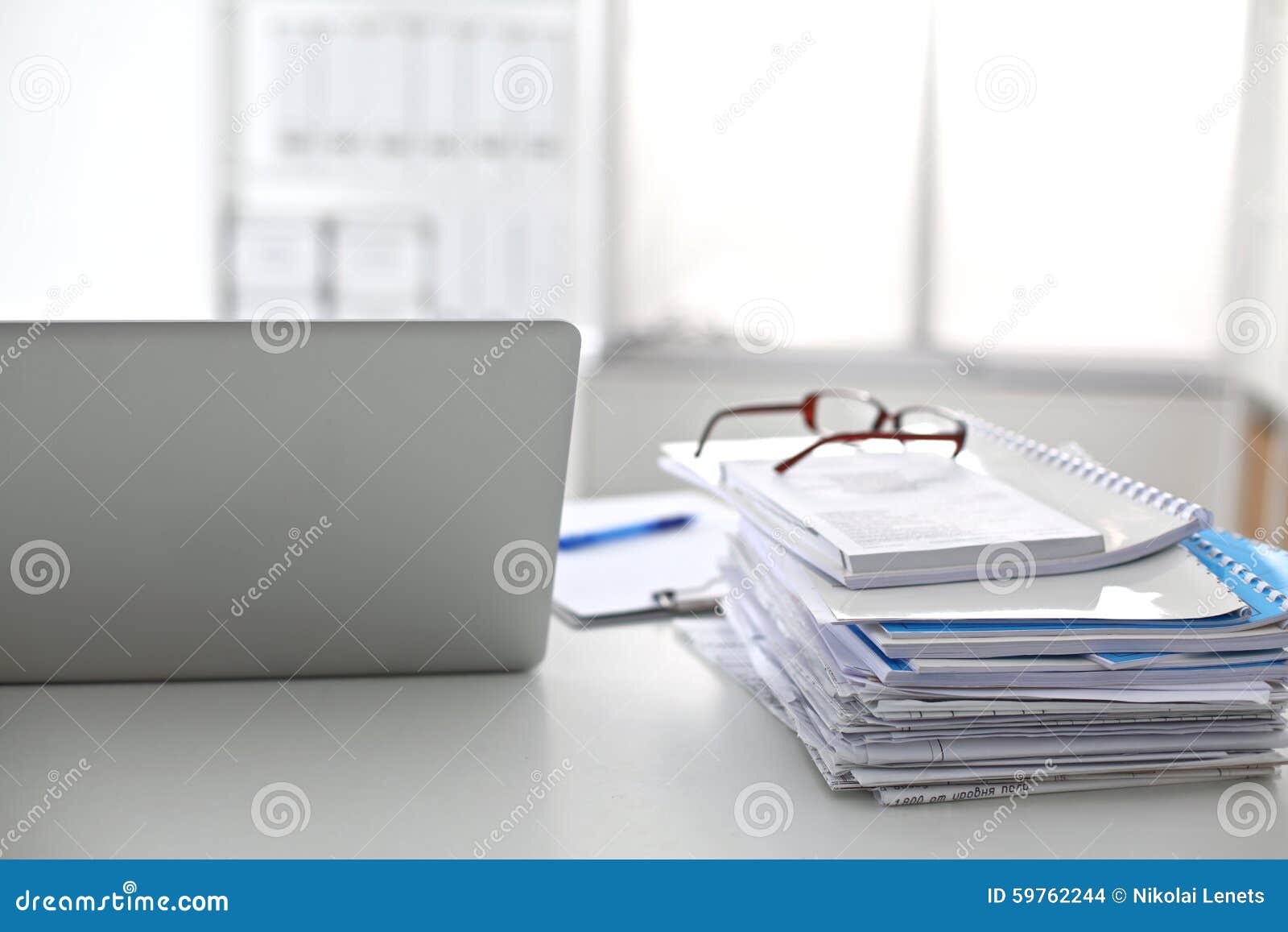 Laptop with Stack of Folders on Table on White Stock Photo - Image of ...