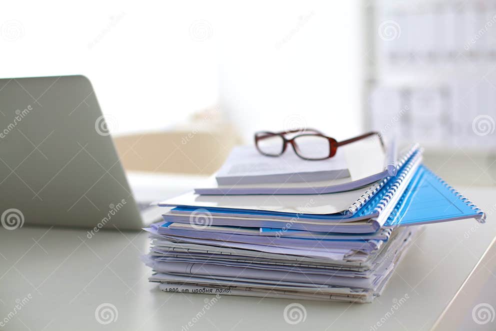 Laptop with Stack of Folders on Table on White Stock Photo - Image of ...