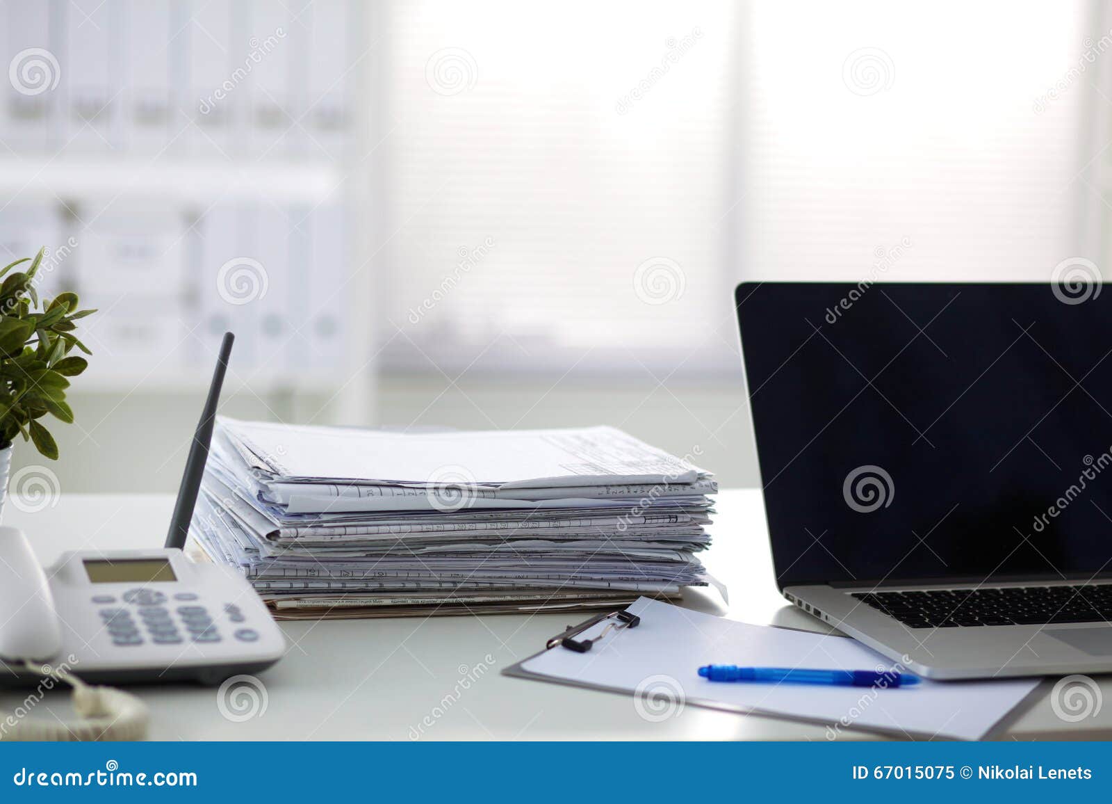 Laptop with Stack of Folders on Table on White Background Stock Image ...