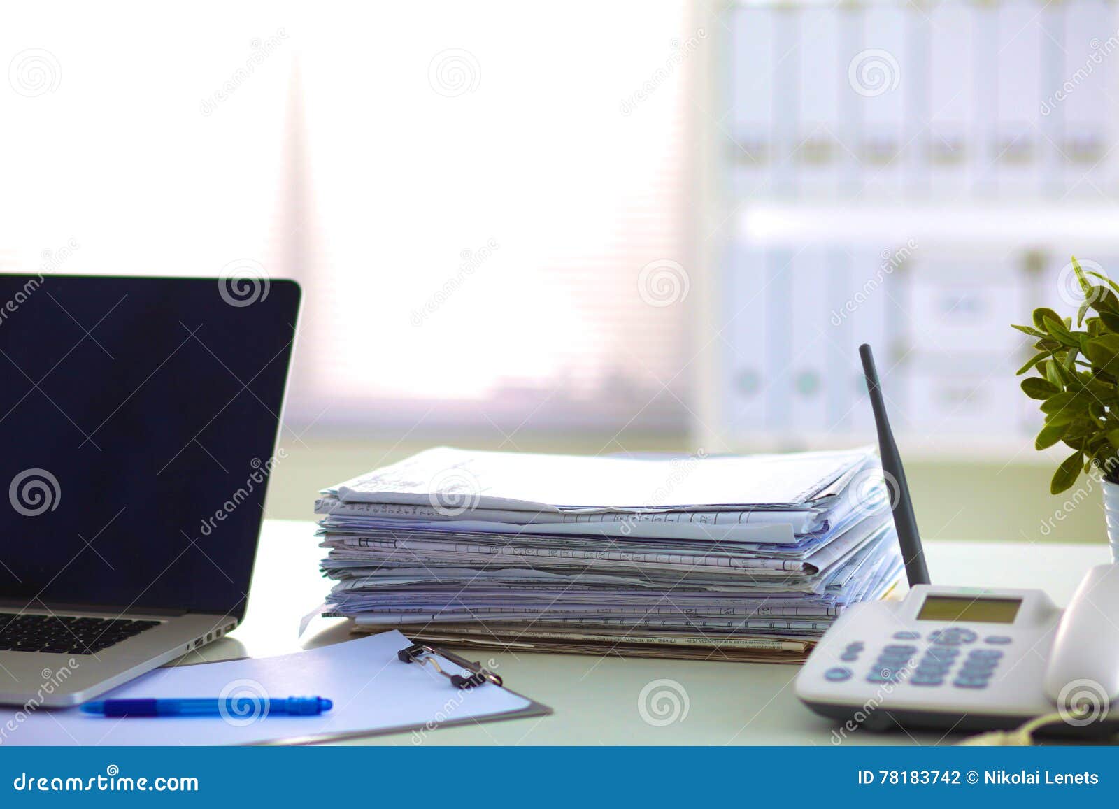 Laptop With Stack Of Folders On Table White Background Royalty-Free ...