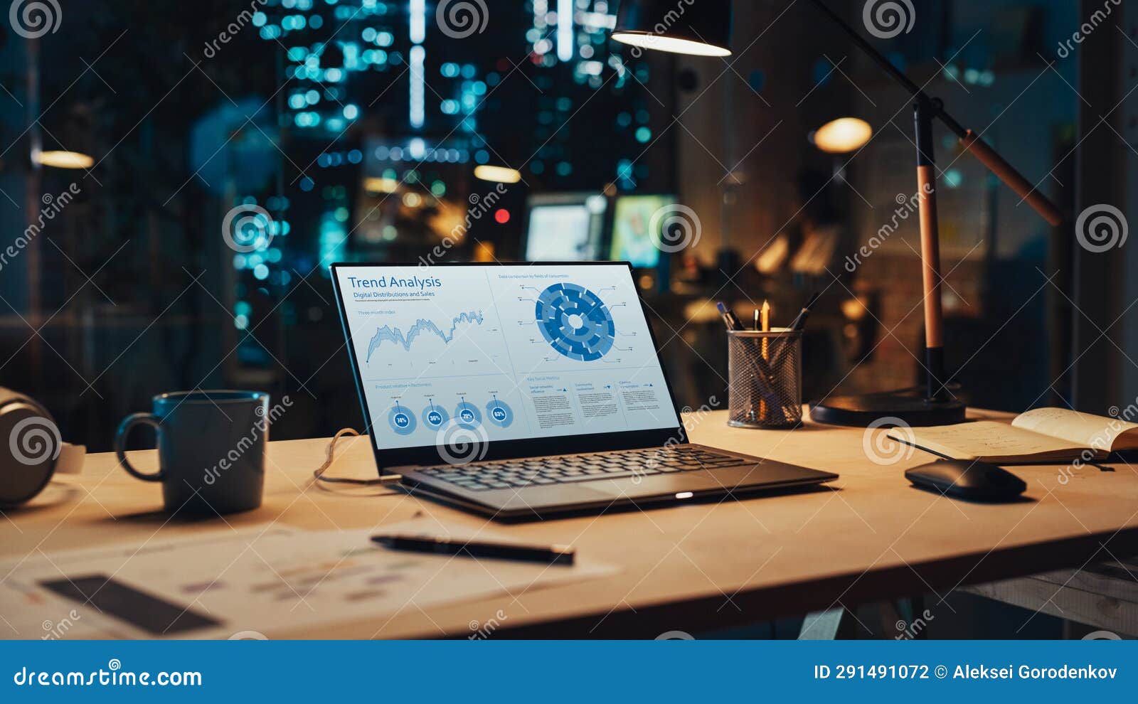 Laptop Standing on a Desk with Sales Statistics and Data Chart ...