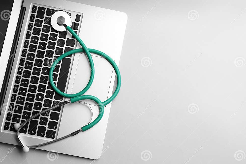 Laptop and Stethoscope on Light Grey Table, Space for Text. Concept of ...