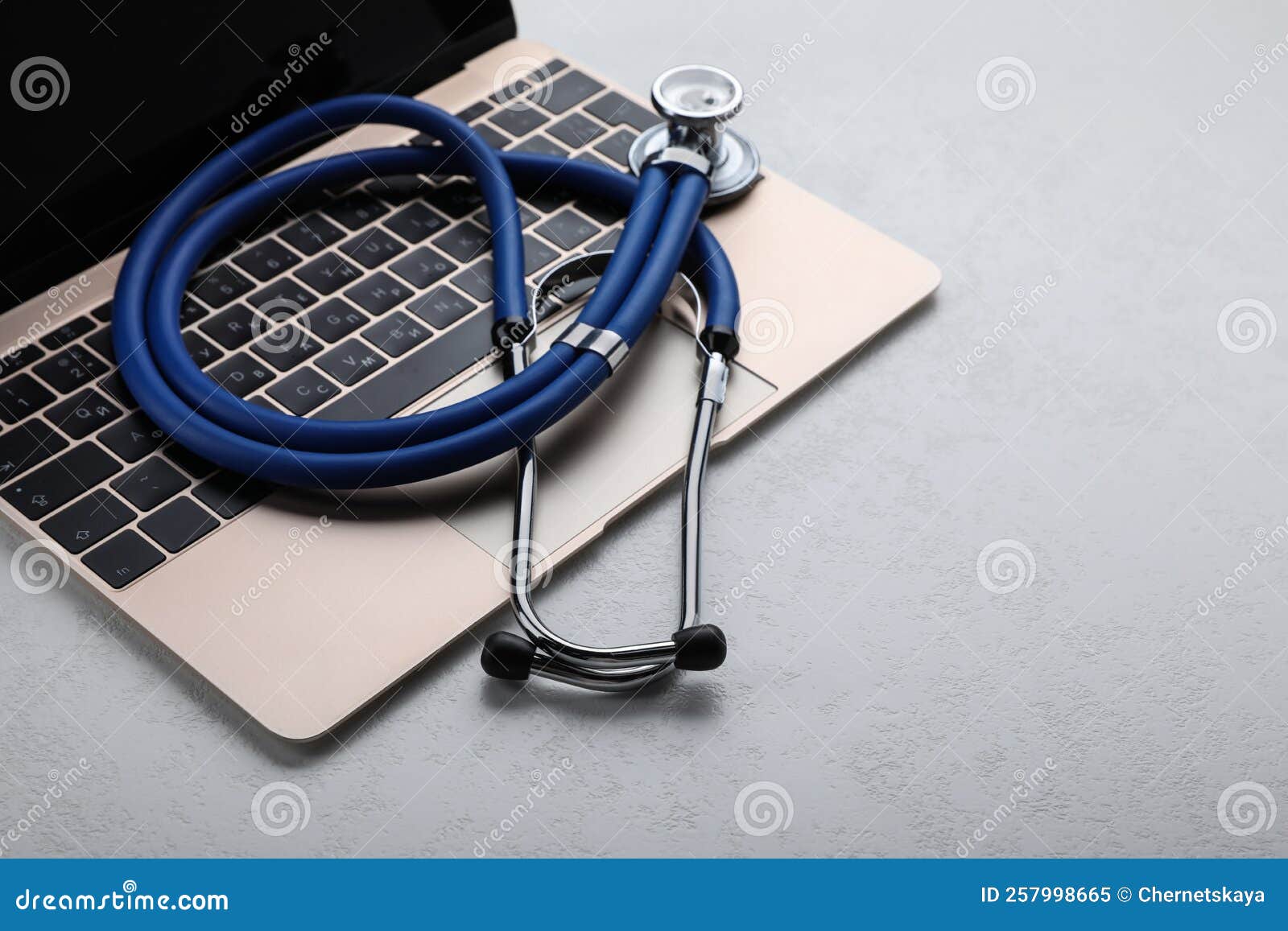Laptop with Stethoscope on White Table, Closeup. Space for Text Stock ...