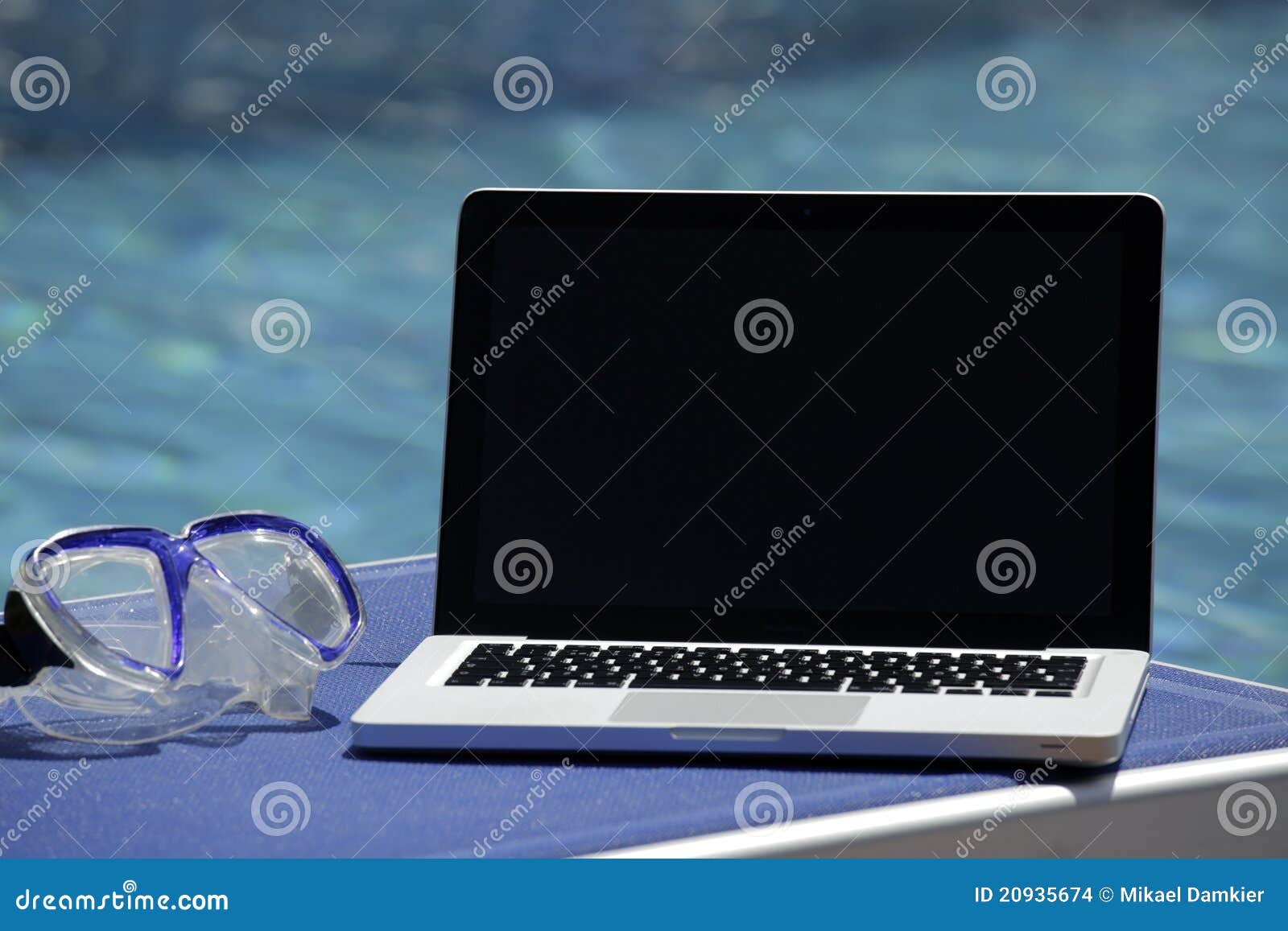 Laptop by swimming pool stock photo. Image of connect - 20935674