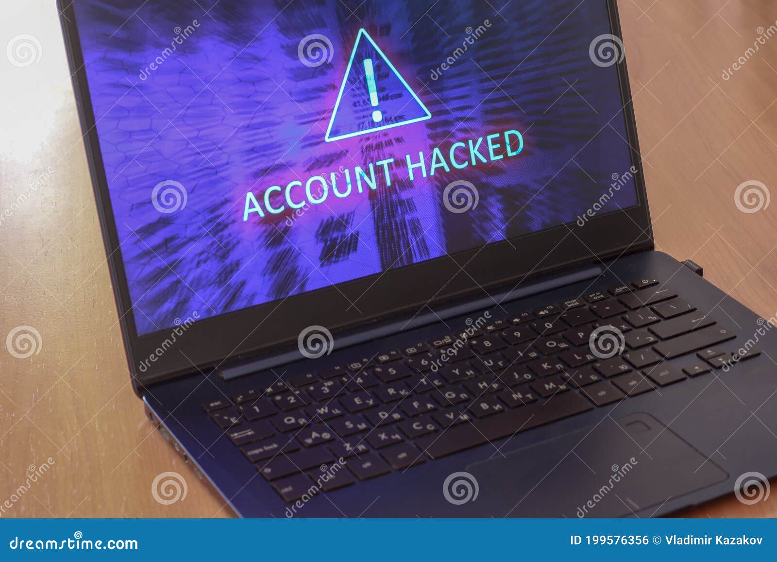 Laptop on the Table and on a Blue Screen the Text Account Hacked. Stock ...
