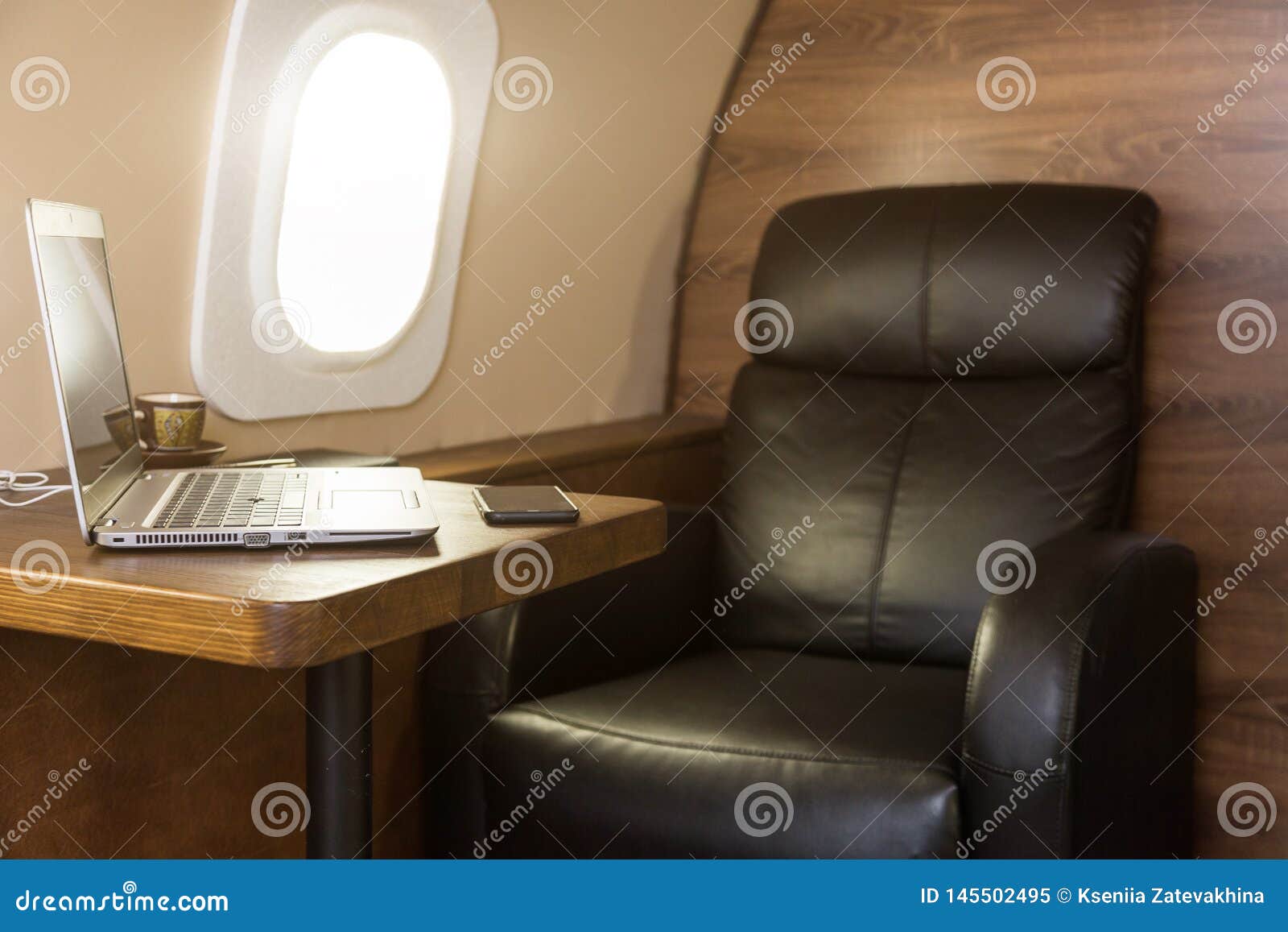 Laptop on the Table in the Interior of a Private Jet. Flying First ...