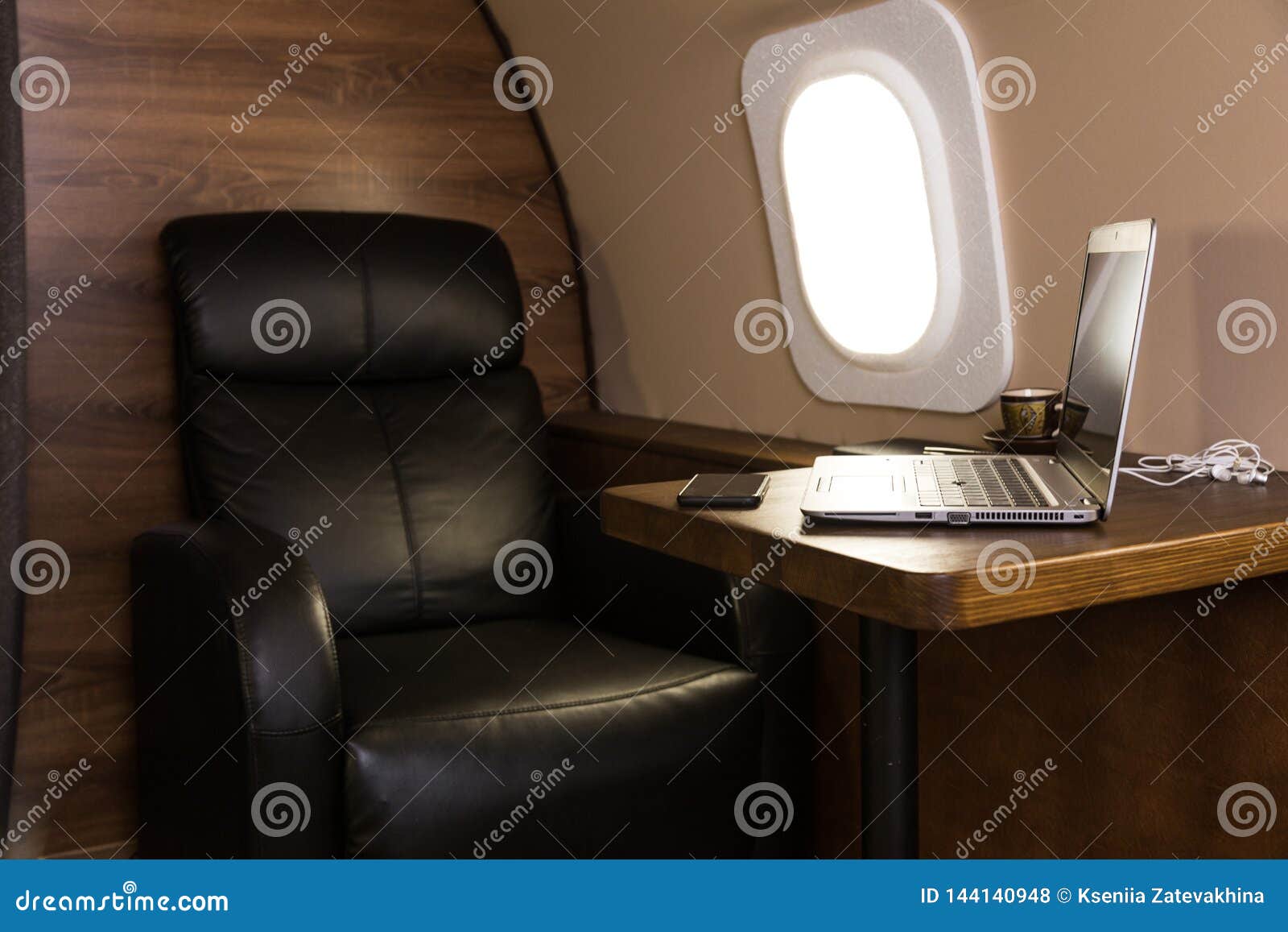 Laptop On The Table In The Interior Of A Private Jet. Flying First ...