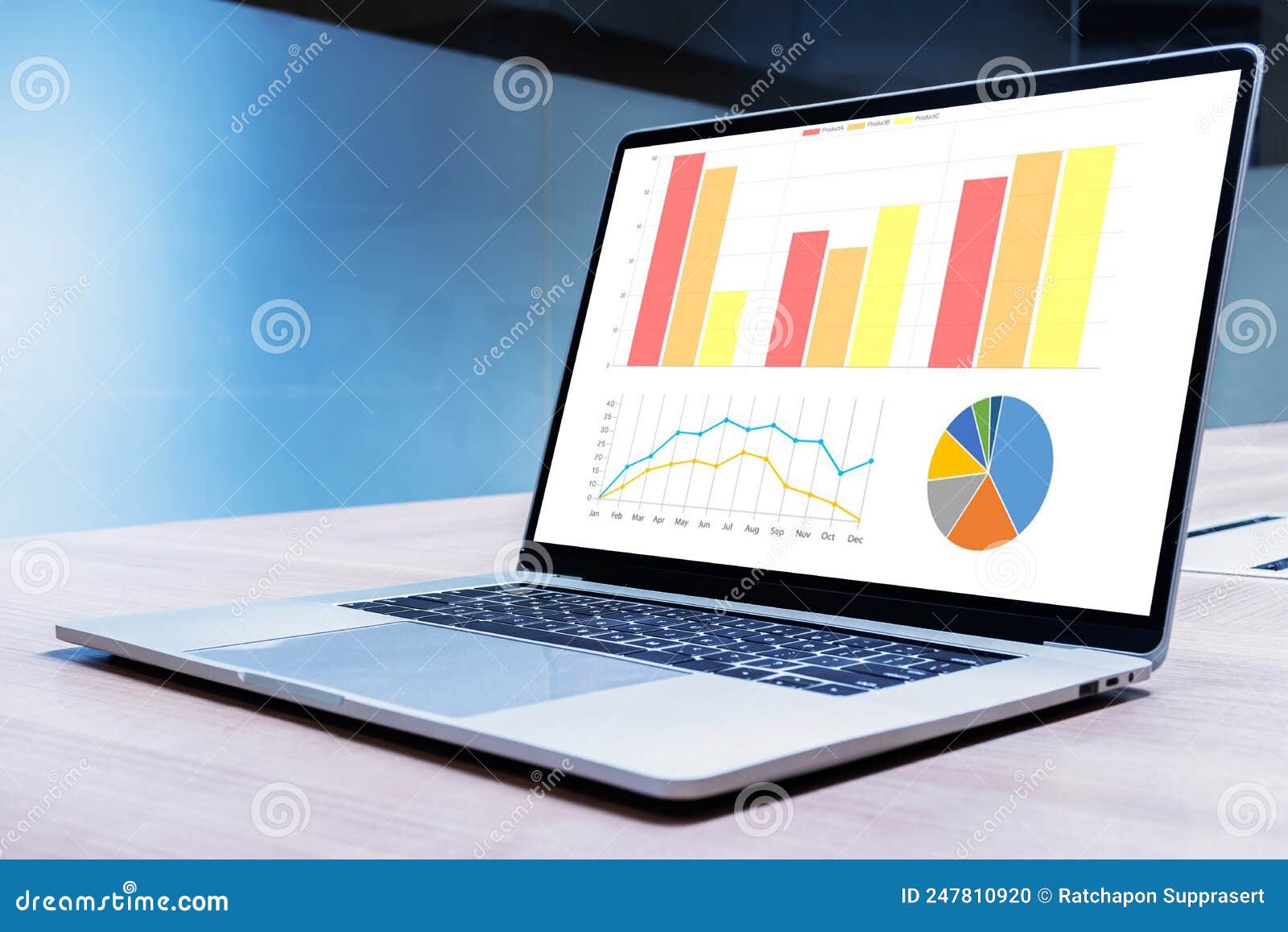 Laptop On Table With Mockup Chart Presentation Slide Show On Display ...