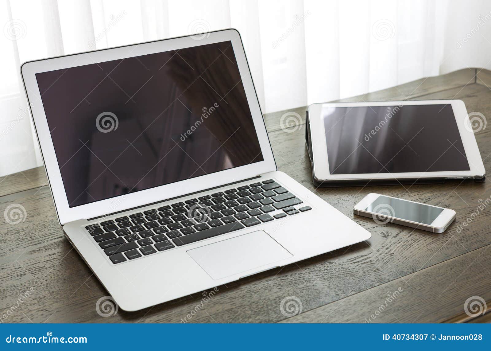 Laptop with Tablet and Smart Phone on Table Editorial Photography ...