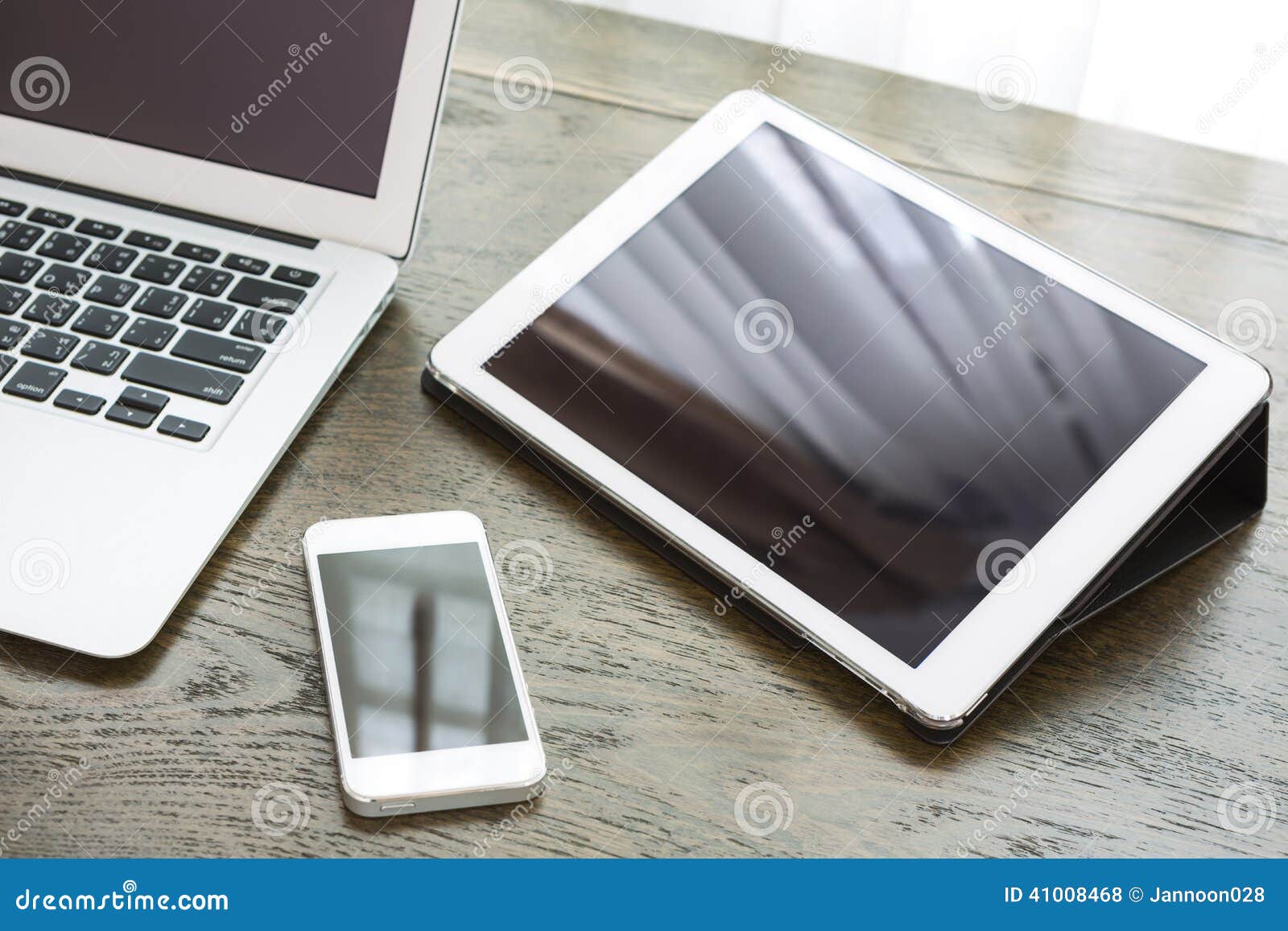 Laptop with Tablet and Smart Phone on Table Stock Photo - Image of ...