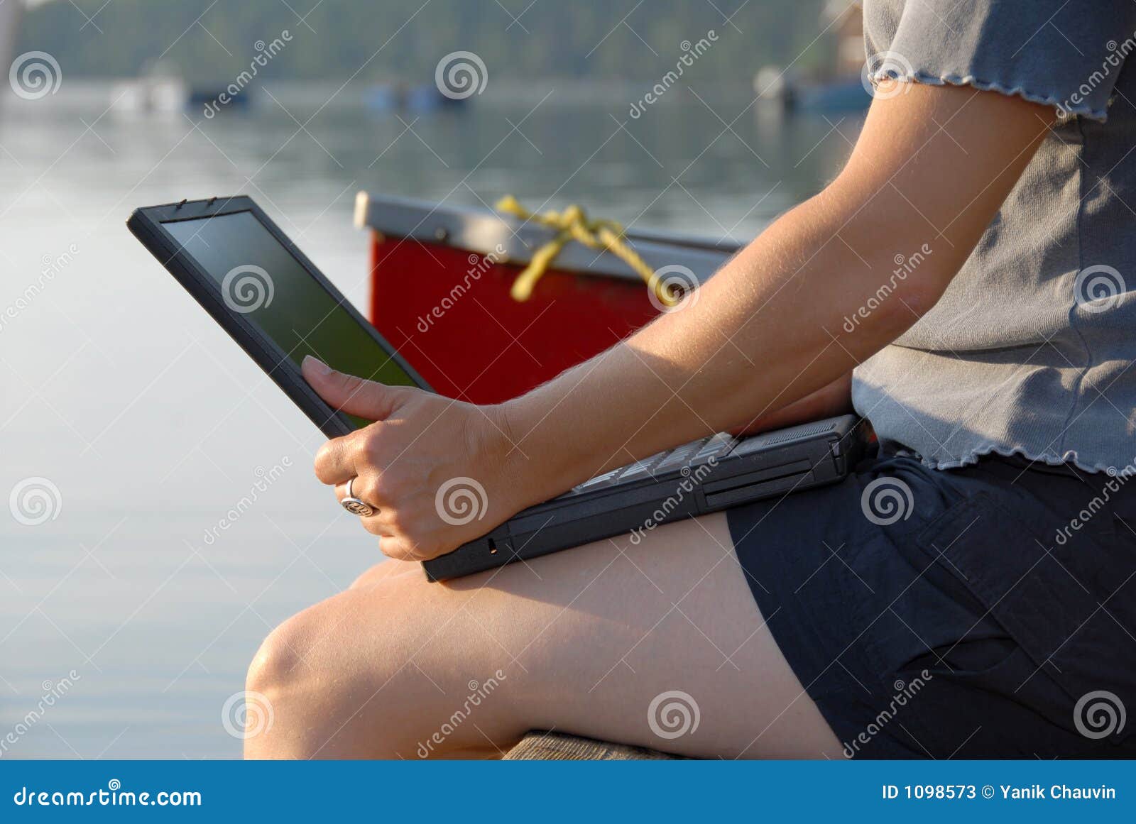 Laptop by the water stock image. Image of sunset, morning - 1098573