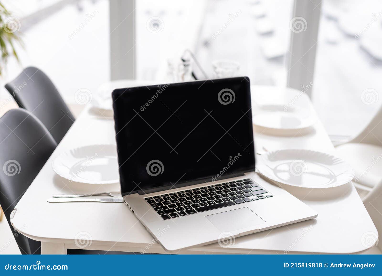 Laptop White Screen on Table with Kitchen Background. Editorial Stock ...