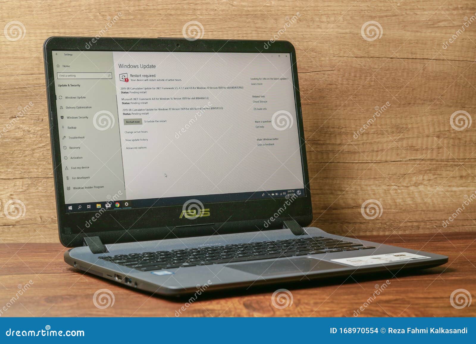 The Laptop with Windows Update on Screen. Its Offers Increased Security ...