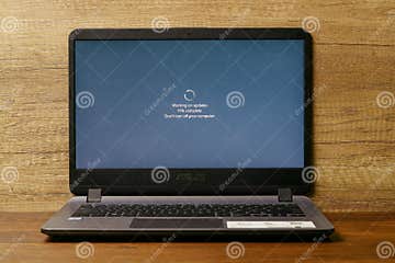 The Laptop with Windows Update on Screen. Its Offers Increased Security ...
