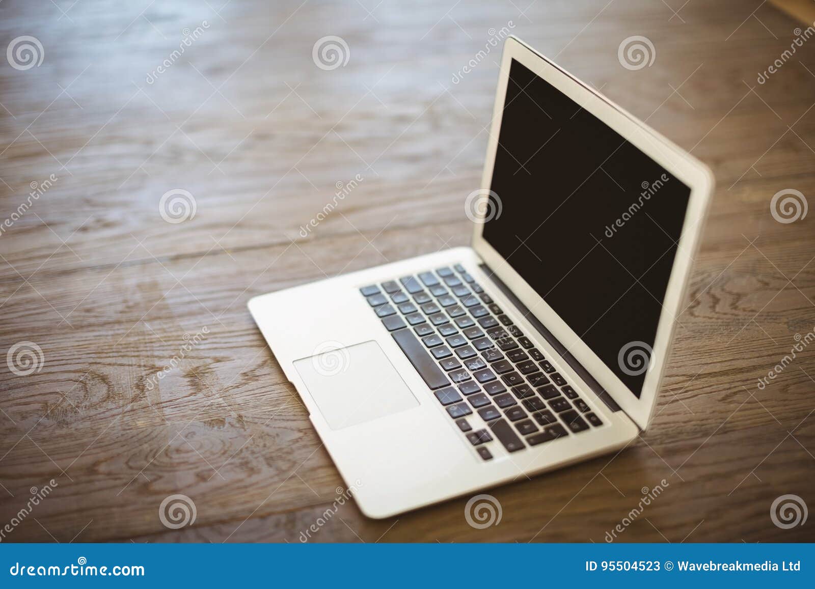 Laptop on wooden floor stock image. Image of electronic - 95504523