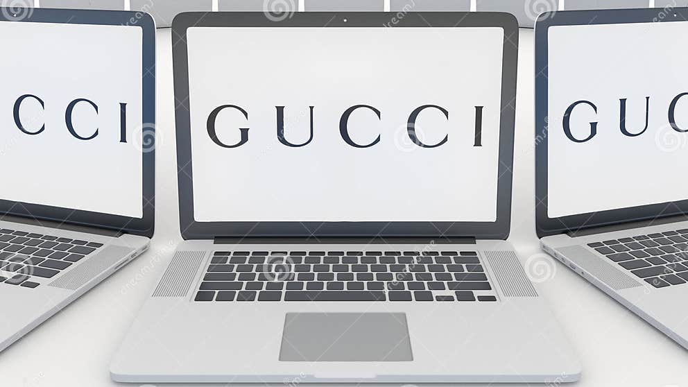 Laptops with Gucci Logo on the Screen. Computer Technology Conceptual ...