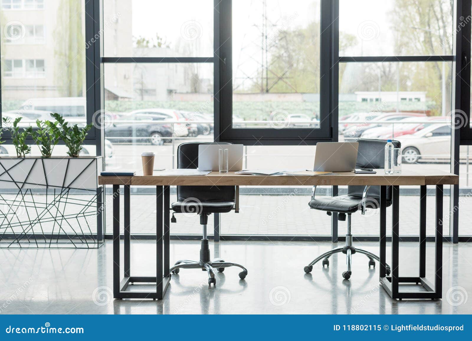 Laptops on table in empty stock image. Image of table - 118802115
