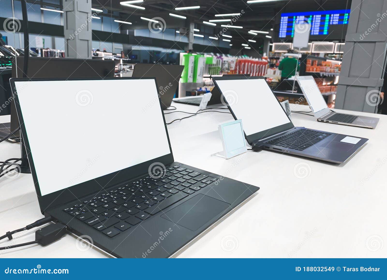 Laptops with a White Screen at the Showcase in the Electronics Store ...