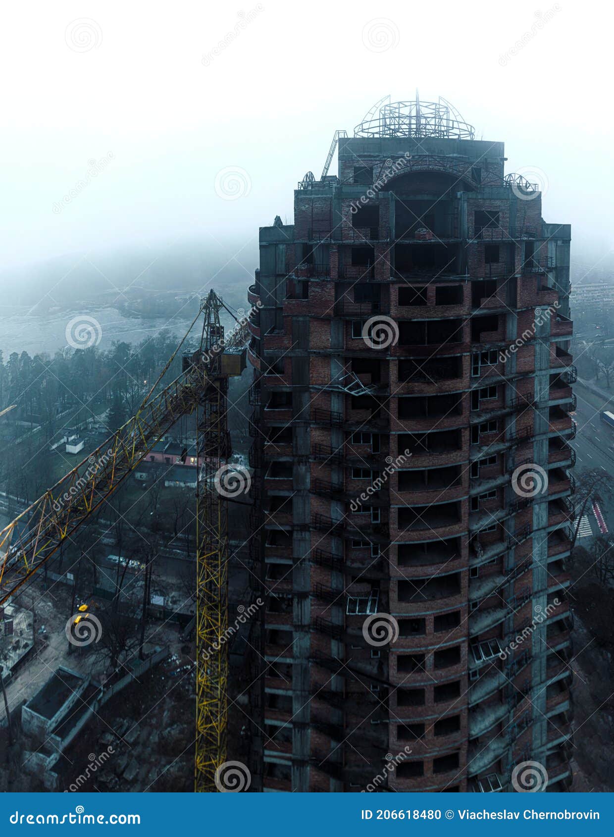 Abandoned Unfinished Brick Building Skyscraper and Big Yellow Machine ...