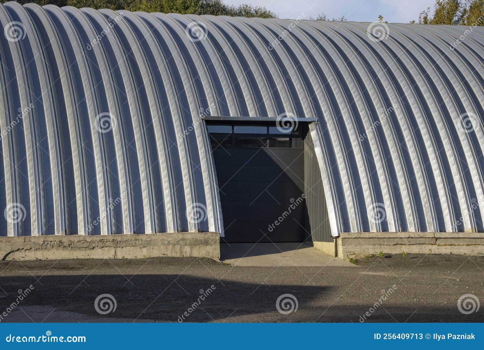 Large Arched Stainless Steel Hangar with Rolling Gates Stock Image ...