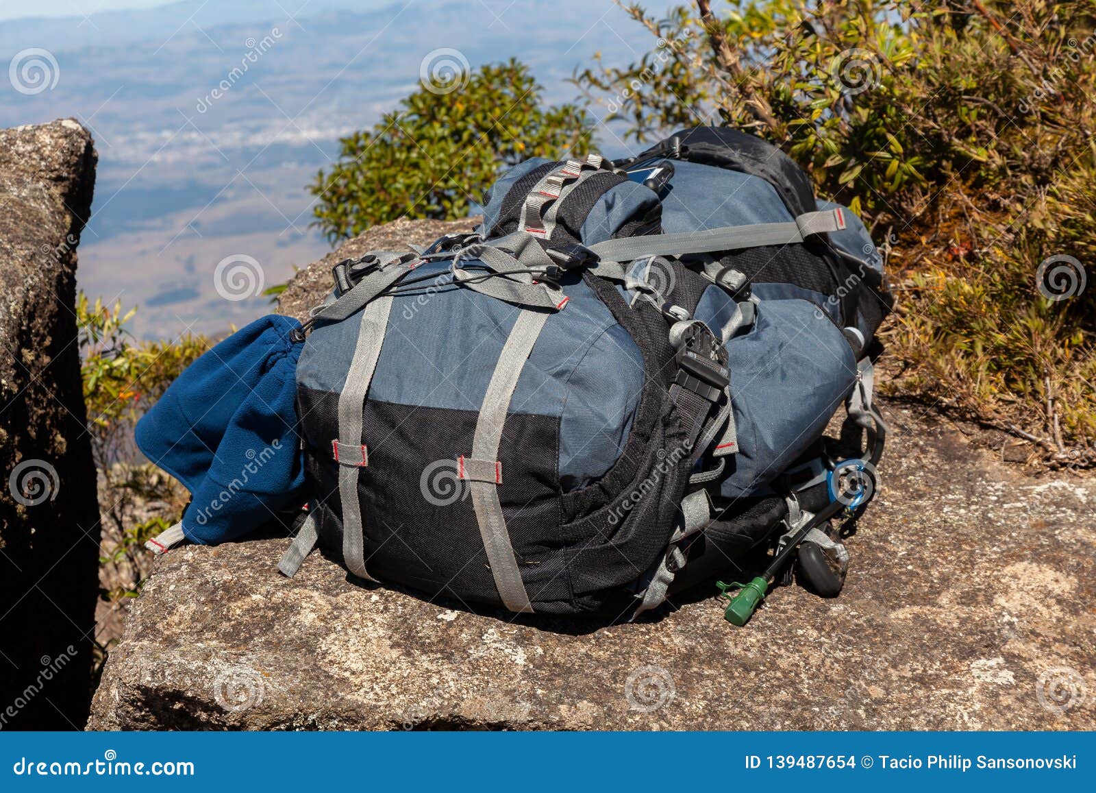 Large Backpack Over a Rock in Mountain Landscape Stock Photo - Image of ...
