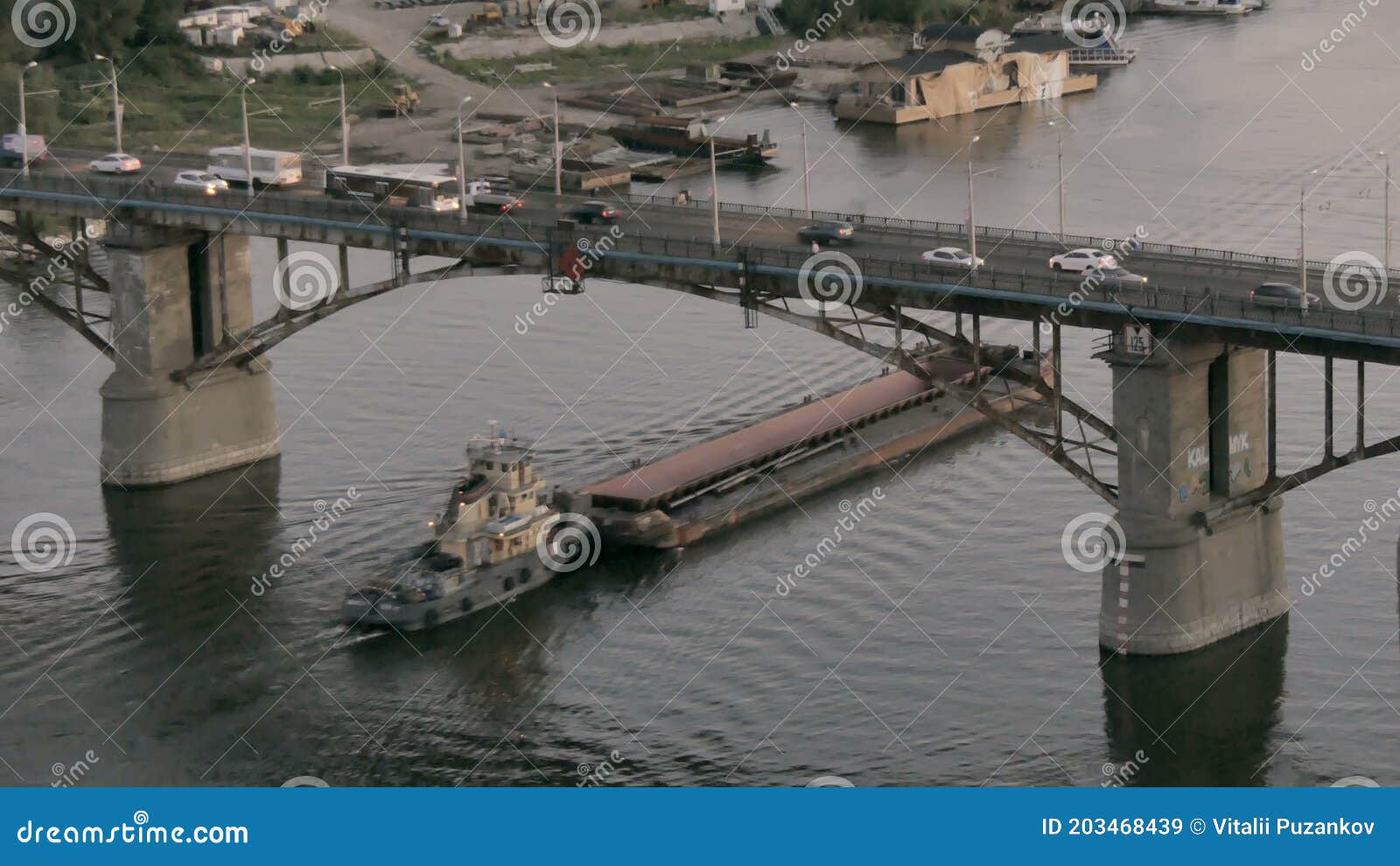 A Large Barge Floats on the River Under the Bridge. a Ship for Carrying ...