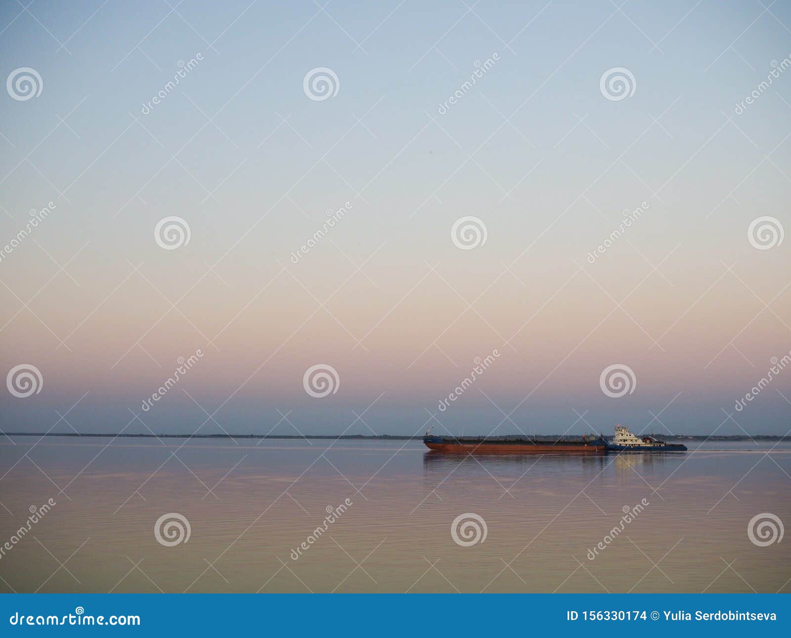 Large Barge Floats on a Smooth River at Sunset Stock Photo - Image of ...