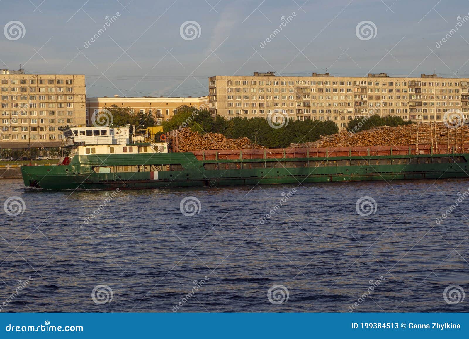 A Large Barge Loaded with Logs is on the River in the City Stock Image ...