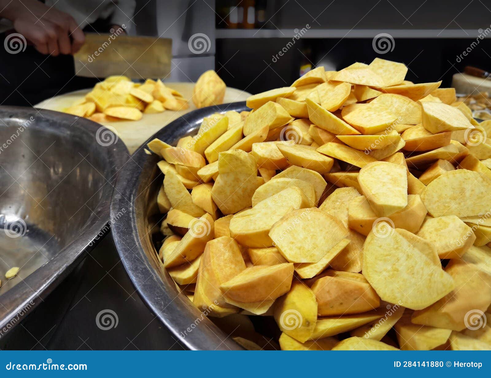 A Large Basin of Cut Triangular Sweet Potato Chunks. Stock Photo ...