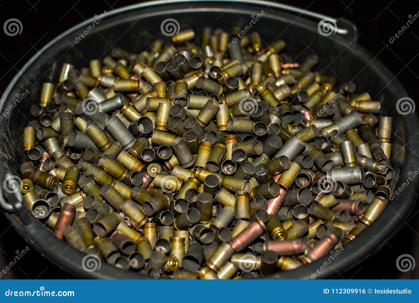 In a Large Black Plastic Bucket is Very Much Used Multi-colored Shell ...