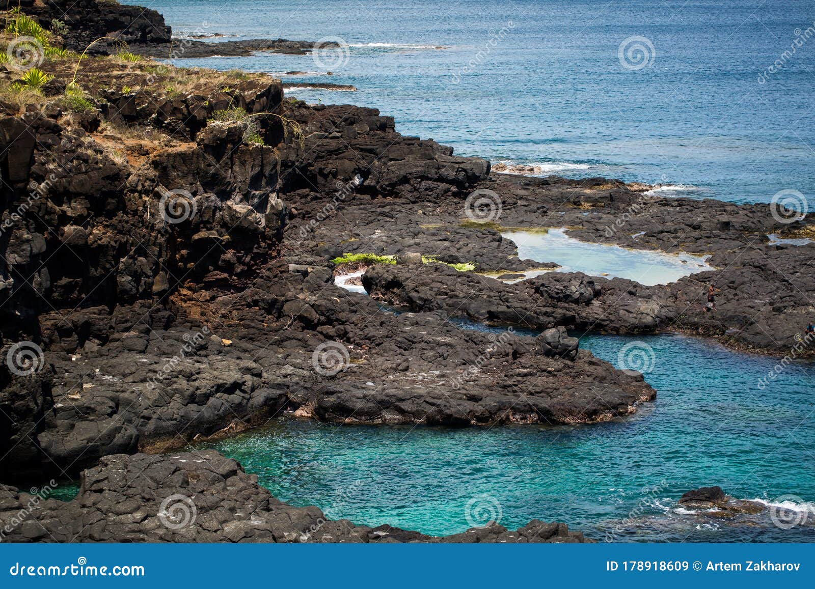 Large Black Stones on the Shore of the Indian Ocean. Mauritius. Stock ...