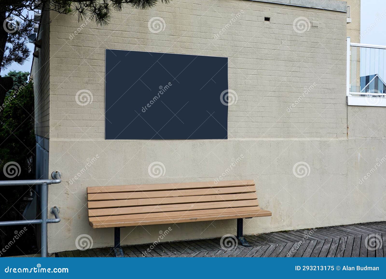 Large Blank Black Sign on a White Brick Wall Over a Bench on a ...