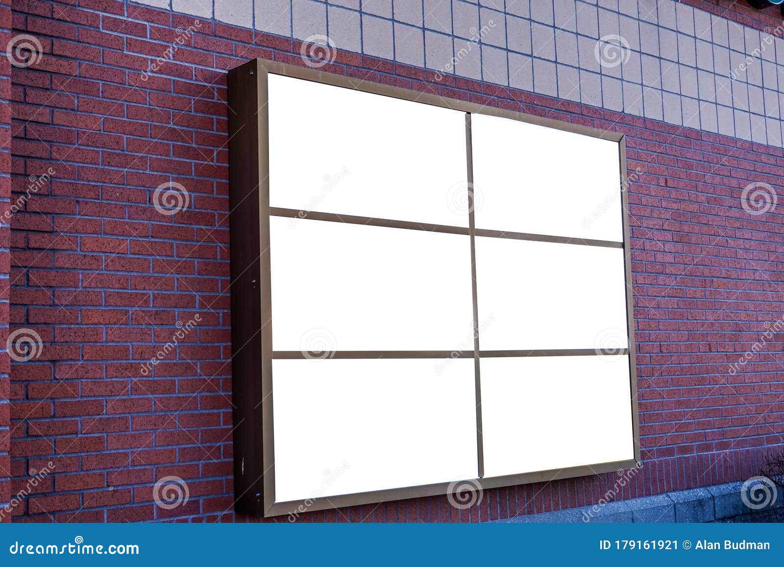 A Large Blank White Sign on a Brick Wall with Six Separate Empty Panels ...