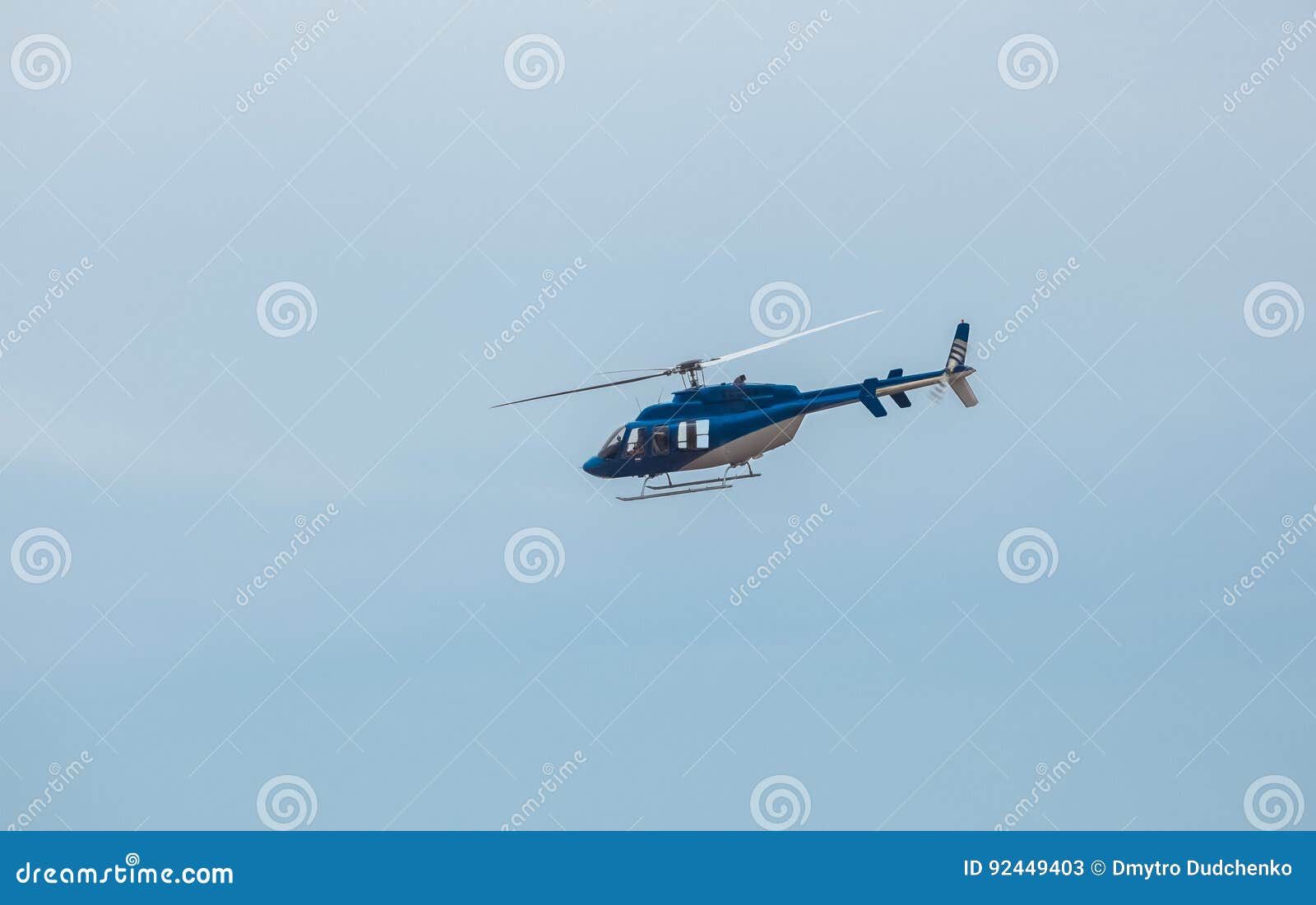 A Large, Blue Helicopter is Flying Stock Image - Image of chopper ...