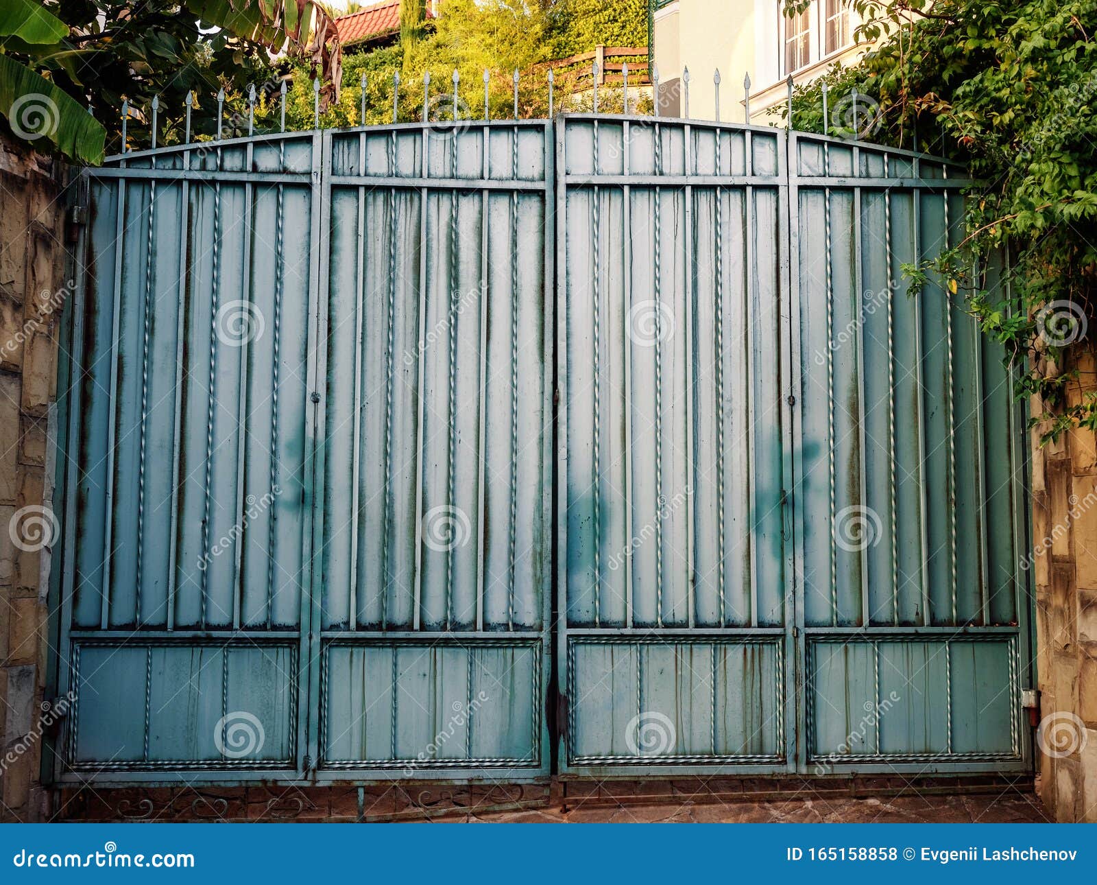 Large Blue Painted Gates with Wrought Iron Elements Front View Stock ...